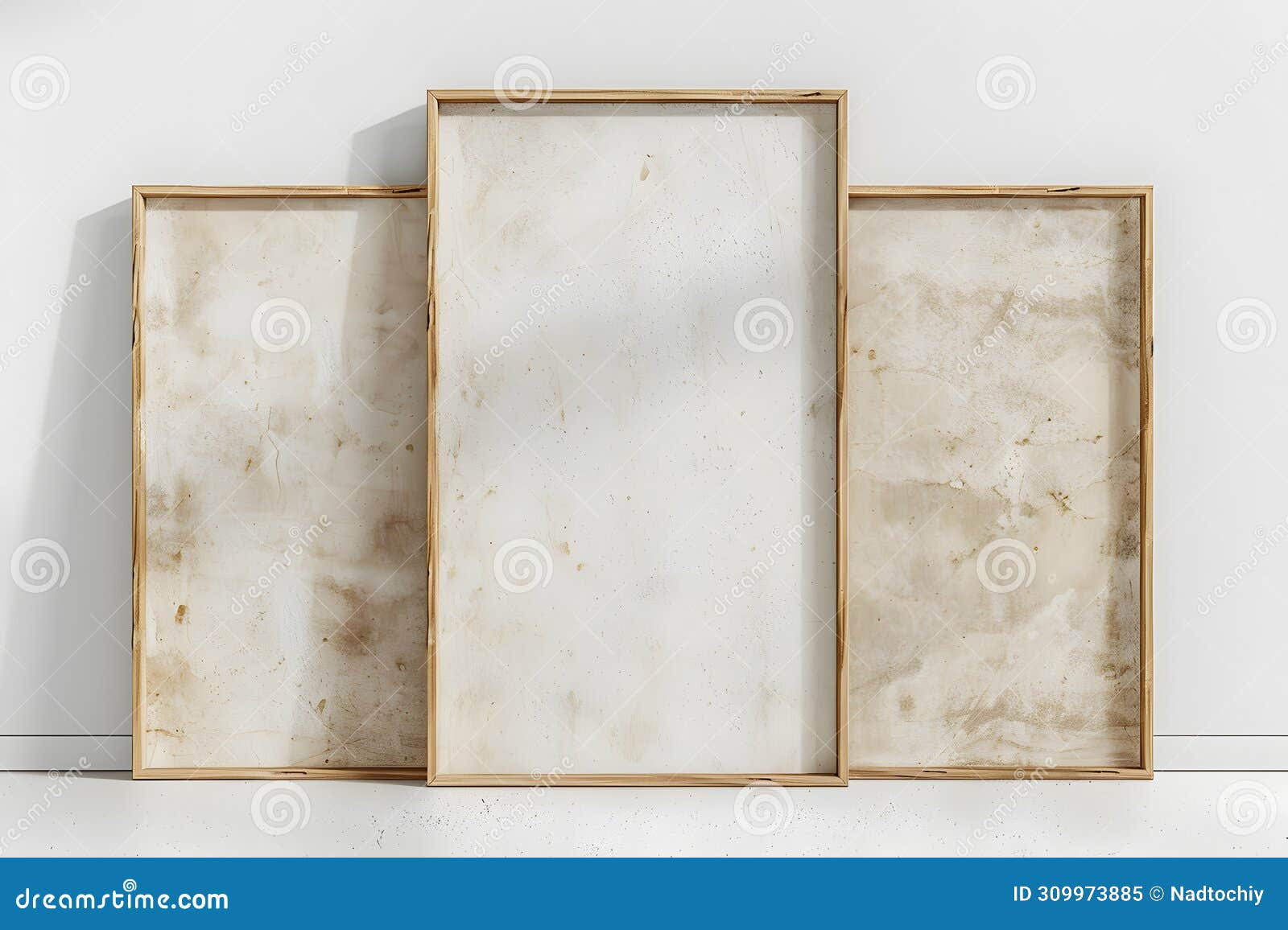 Three Rectangular Frames in Wood and Metal on a Beige Wall Stock Image ...