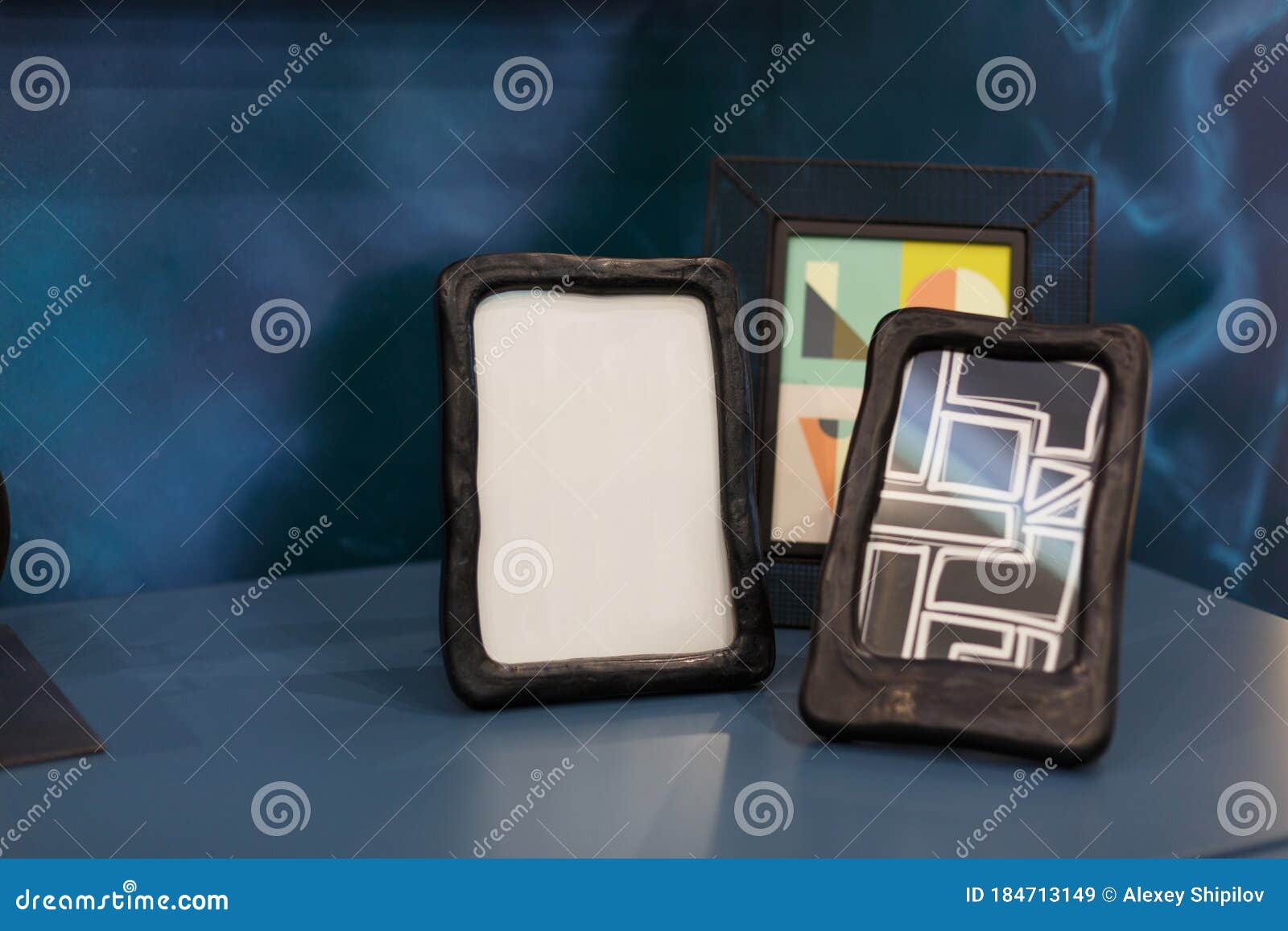 Three Rectangular Photo Frames Stand on the Table Stock Image - Image ...