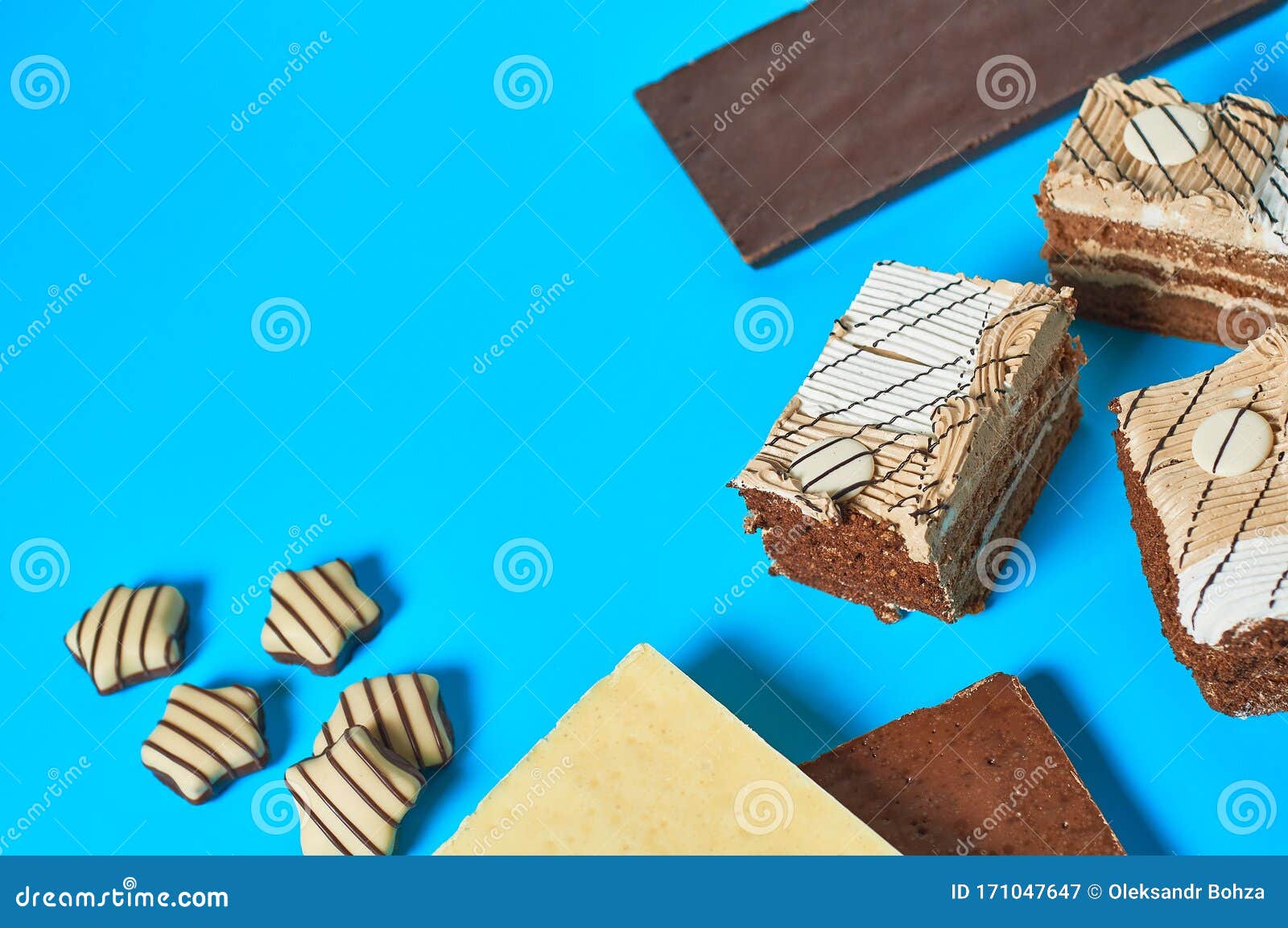 Three Rectangular Pieces of Cake beside Different Chocolate Bars and ...
