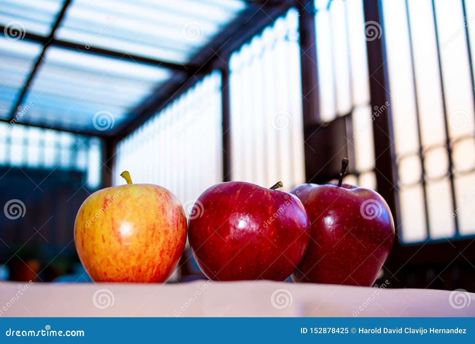 Three apples on the table stock image. Image of delicious - 152878425