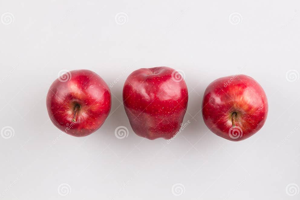 Three red apples on white stock image. Image of natural - 57944945