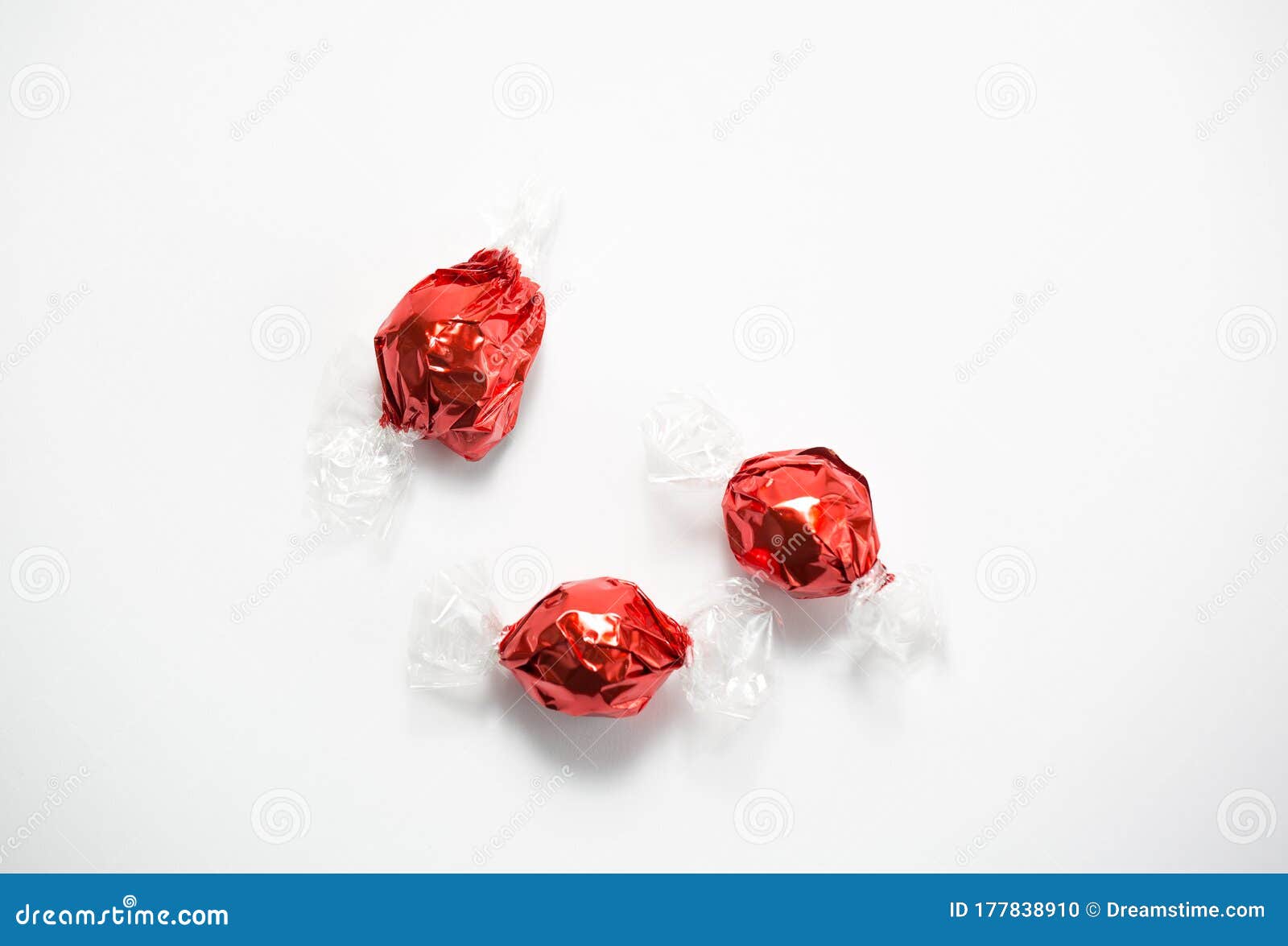 Three Red Candies on a White Background Stock Photo - Image of colorful ...