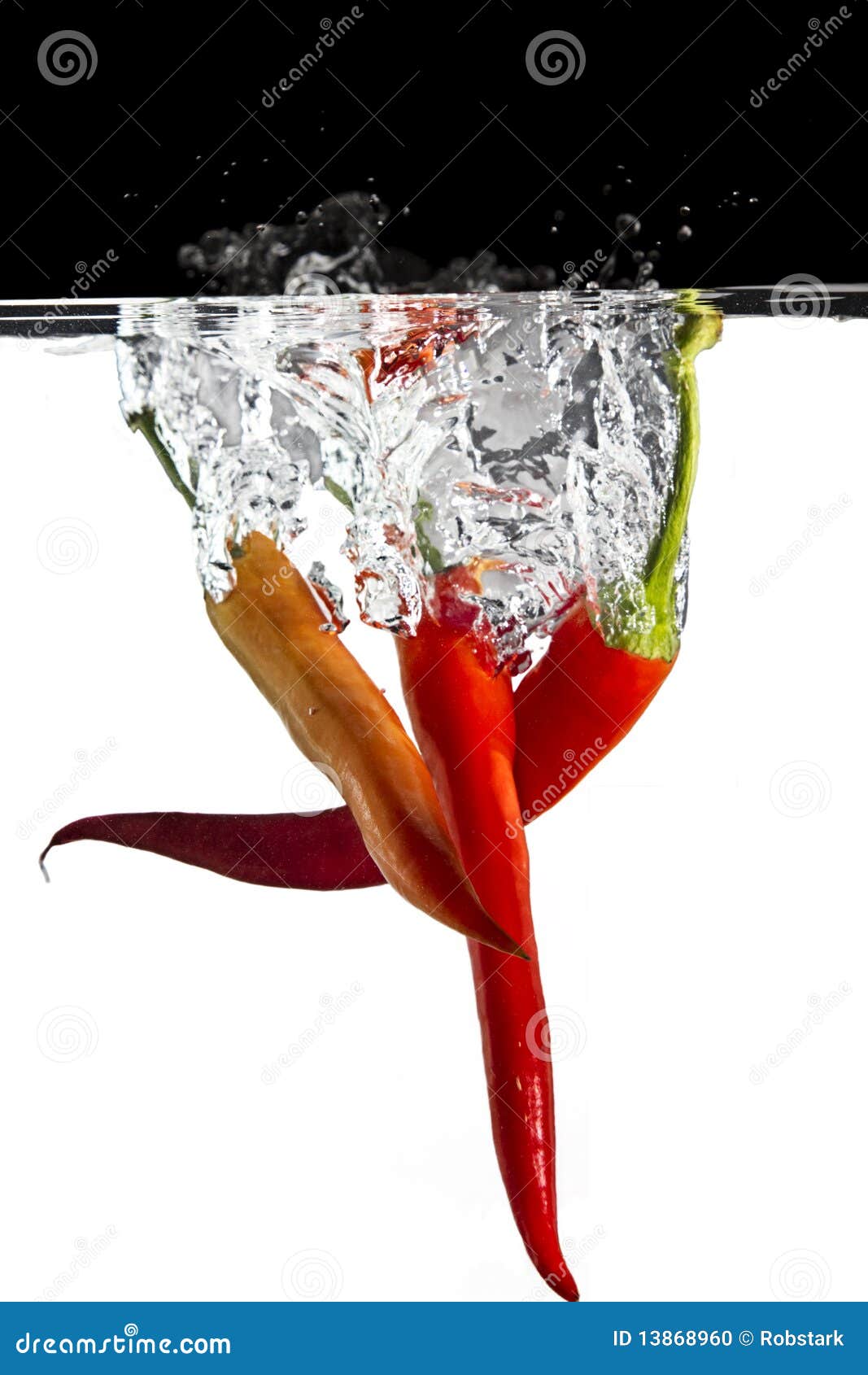 Three red chilli in water stock photo. Image of drop - 13868960
