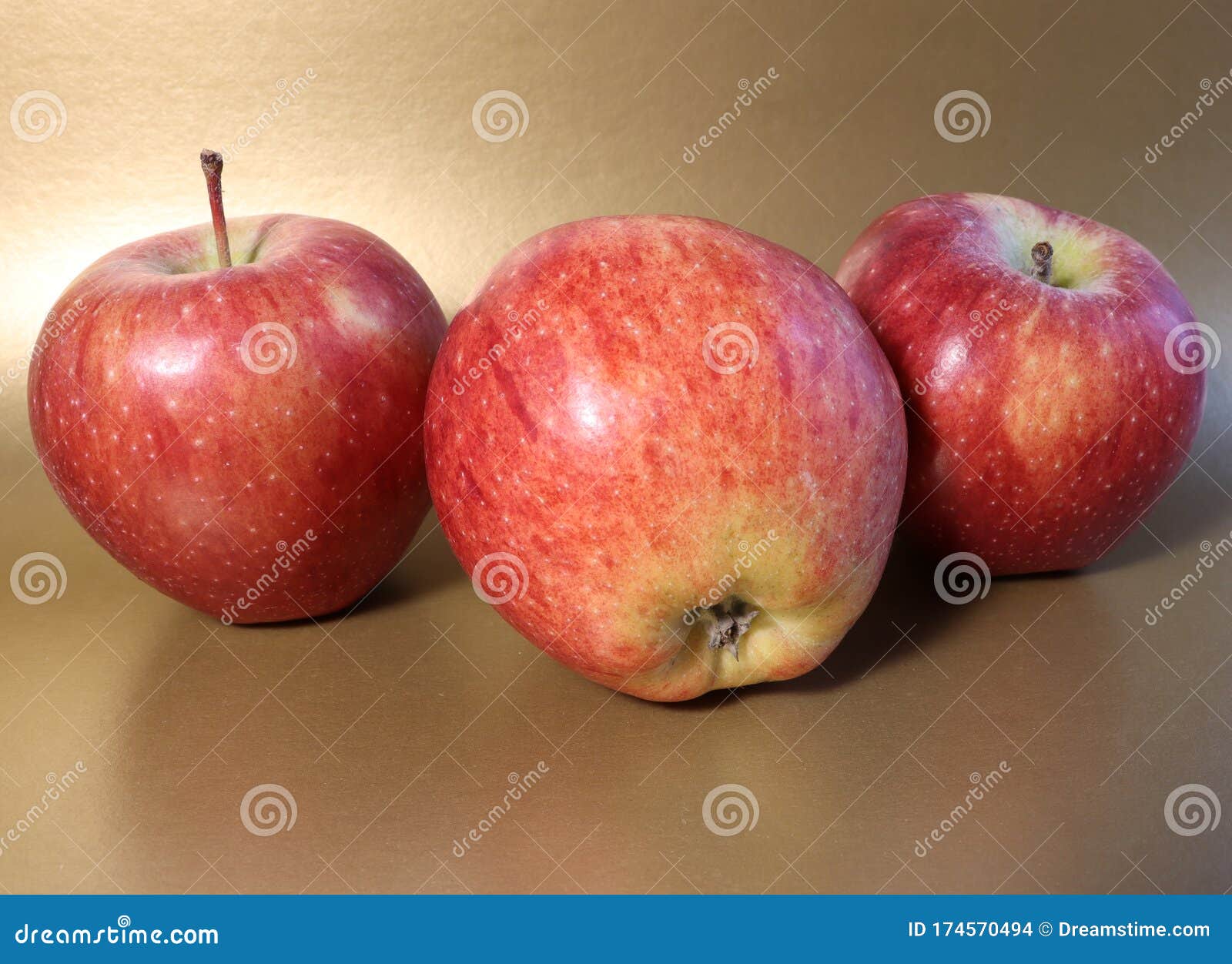 Three red juicy apples stock photo. Image of large, white - 174570494
