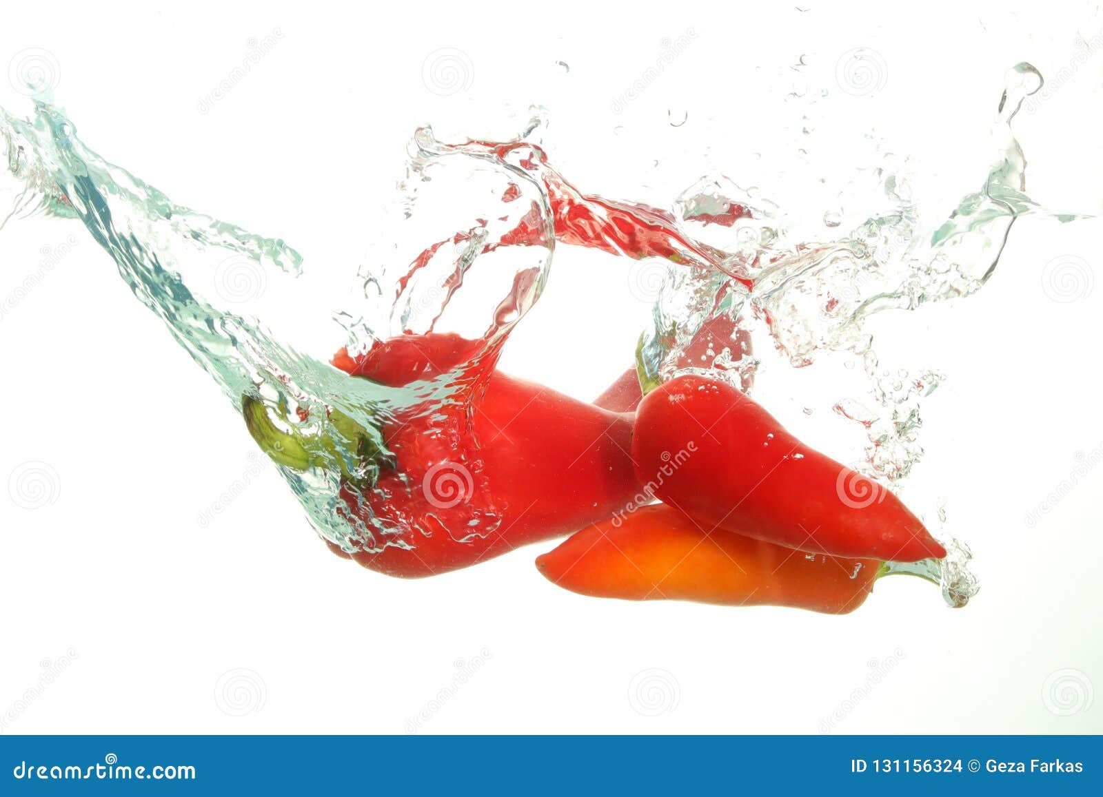 Three Red Parika in Water Splash on White Stock Photo - Image of ...