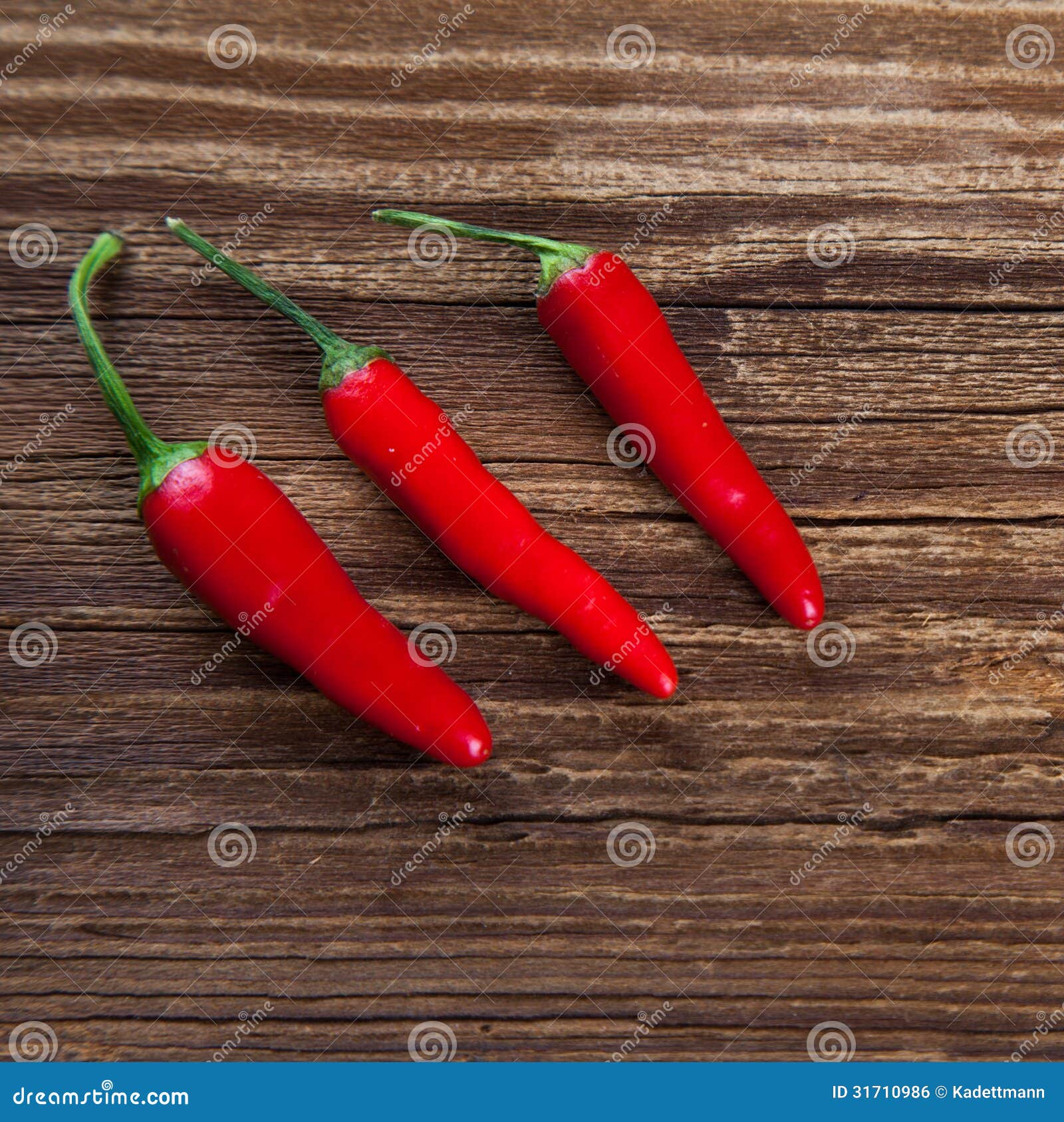 Three Red Pepperoni on Wood Stock Photo - Image of sharpness, chili ...