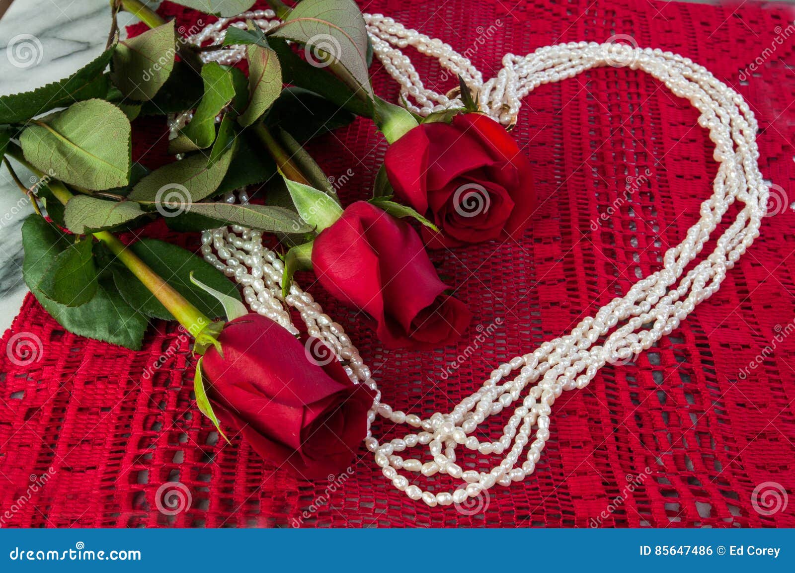 Three Red Roses and Pearls in the Sharpe of a Heart Stock Photo - Image ...