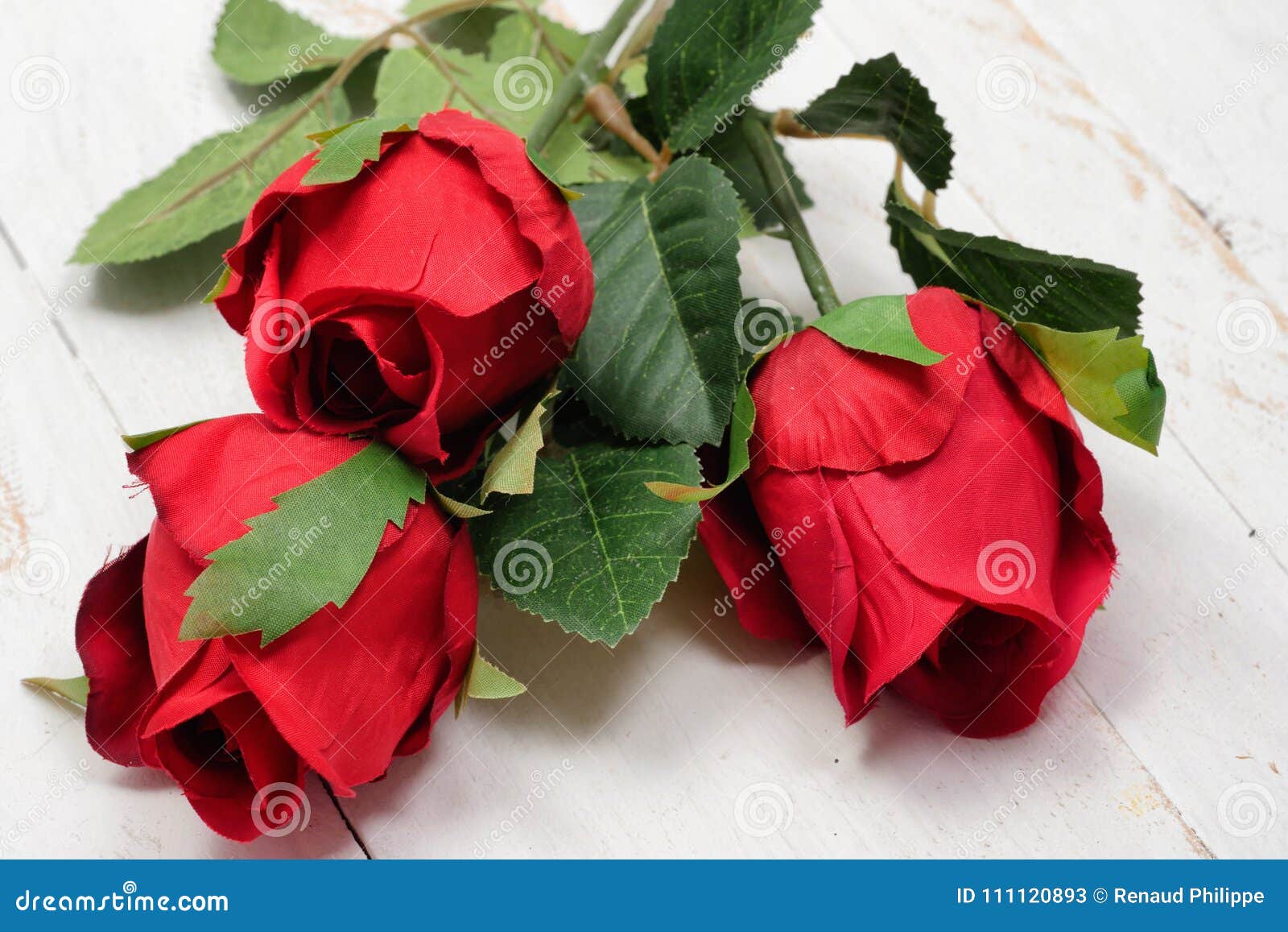 Three Red Roses on the Wooden Table Stock Image - Image of valentines ...