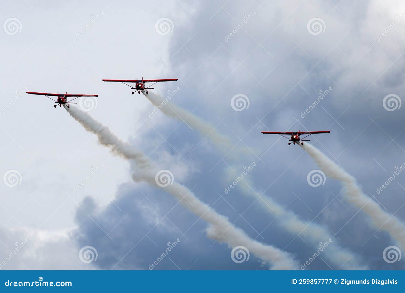 Three Red Sports Planes Make a Parallel Flight during an Air Show Stock ...