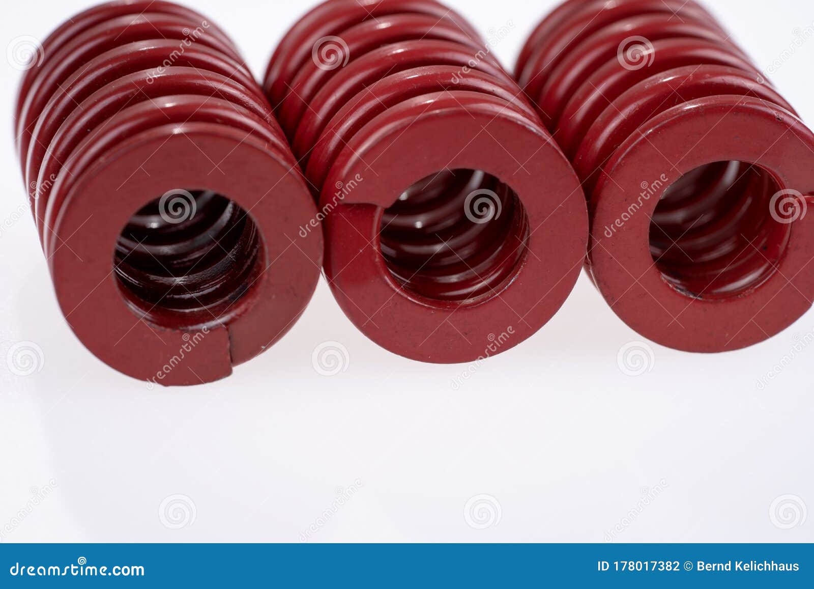 Three Red Strong Metal Springs Isolated on a White Stock Photo - Image ...