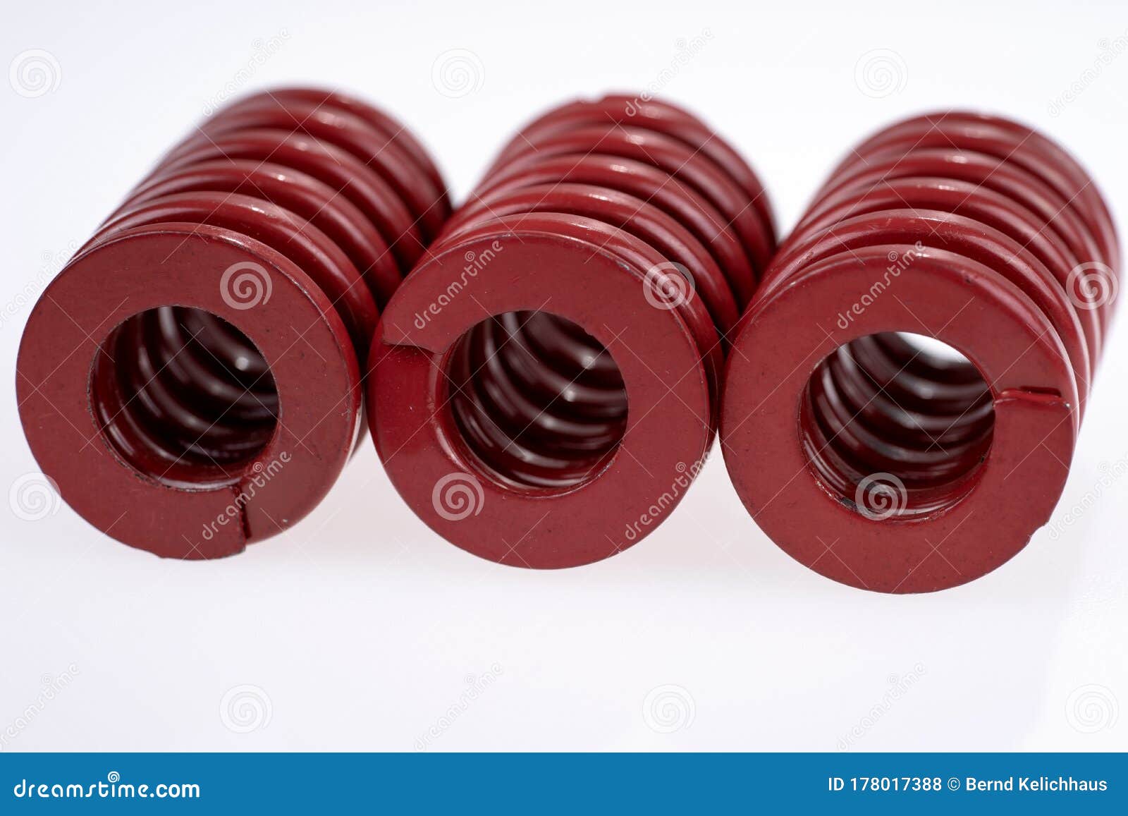 Three Red Strong Metal Springs Isolated on a White Stock Photo - Image ...