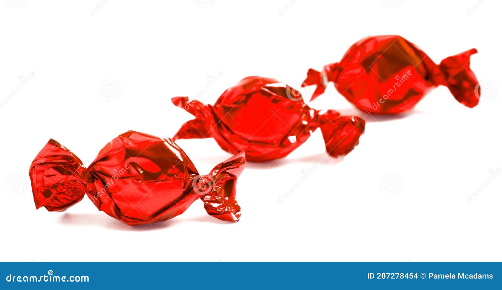 Three Red Wrapped Candy on a White Background Stock Photo - Image of ...