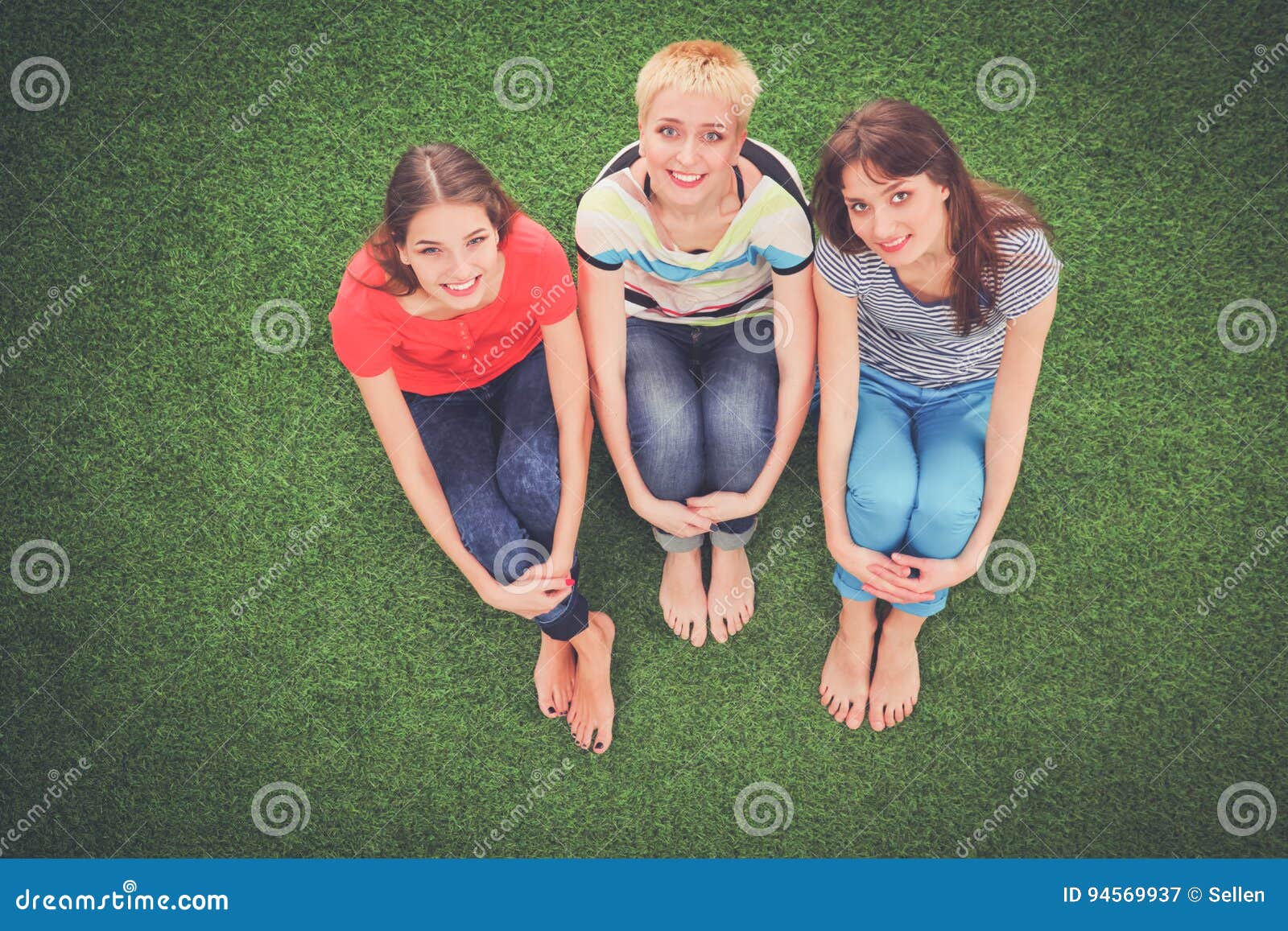 Three Relaxing Beautiful Flirting Women Sit on Green Grass Stock Image ...