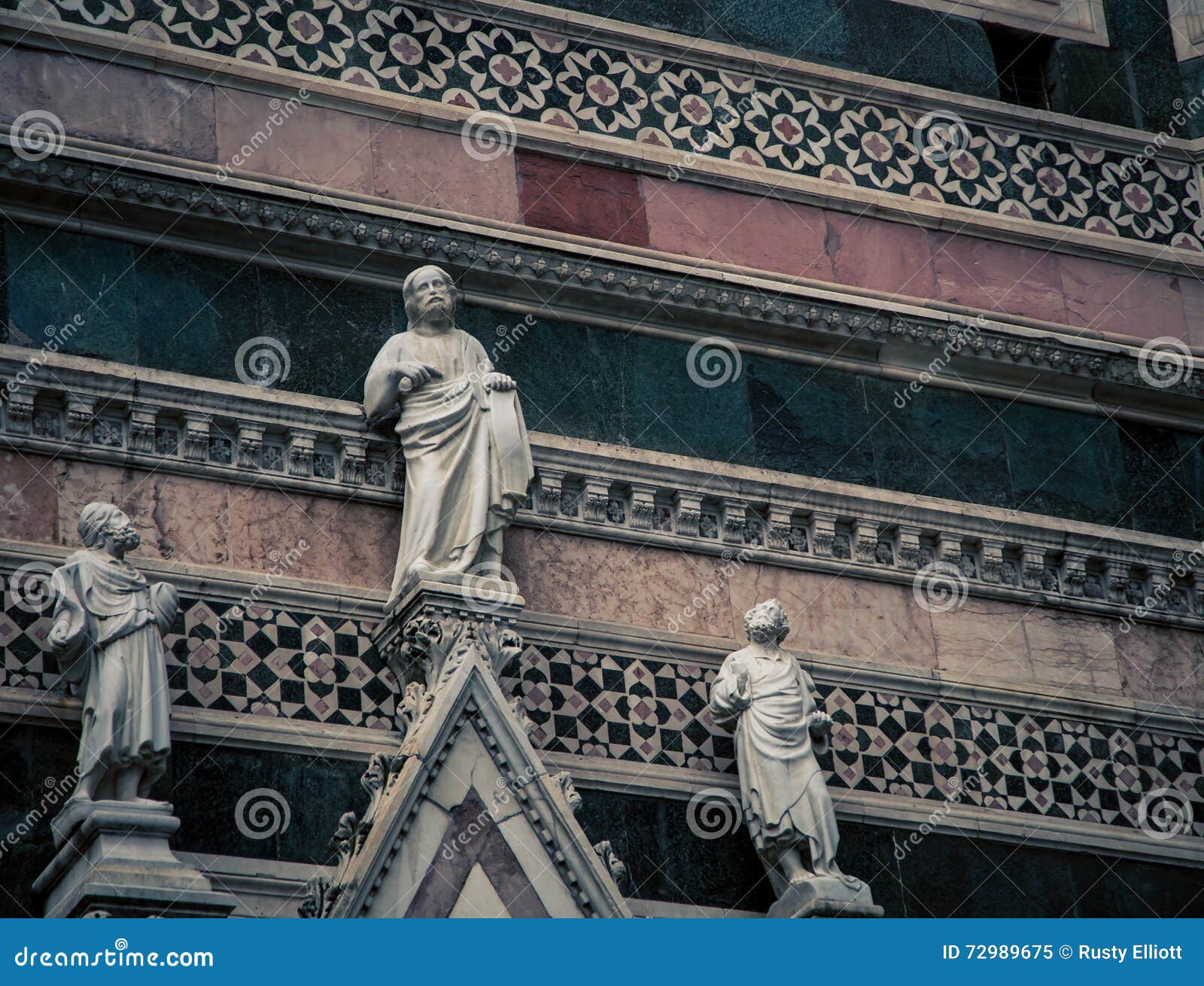 Three religious statues stock image. Image of architecture - 72989675