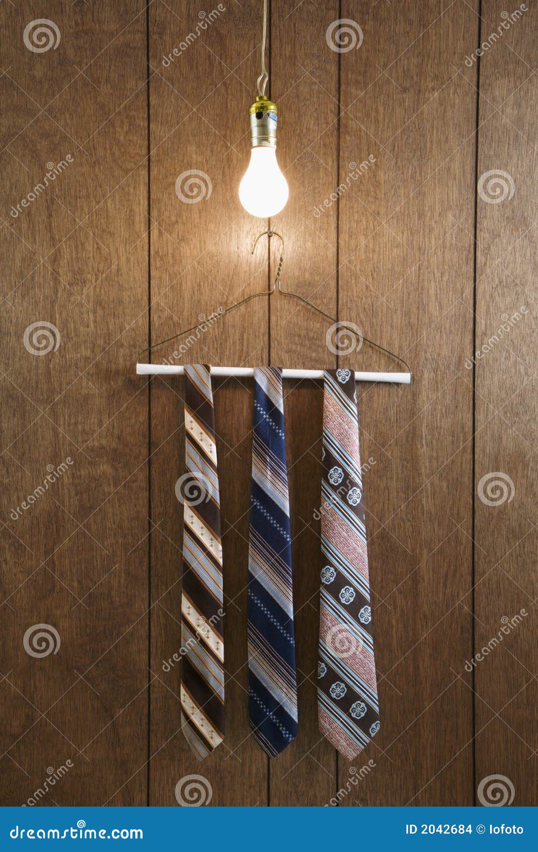 Three Retro Ties on Hanger Beneath Lightbulb. Stock Photo - Image of ...