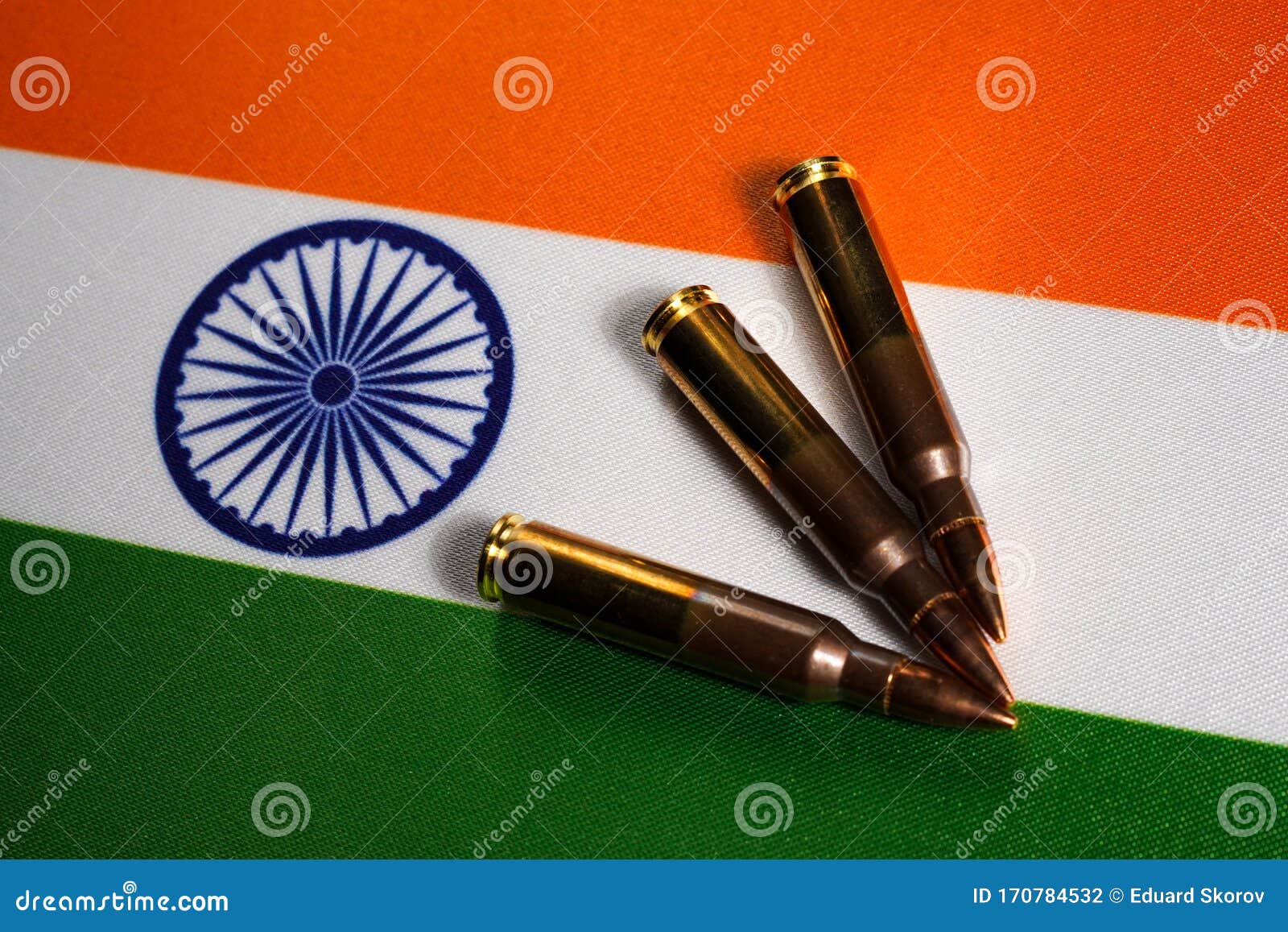 Three Rifle Cartridges on the Flag of India. Close-up, Copy Space Stock ...