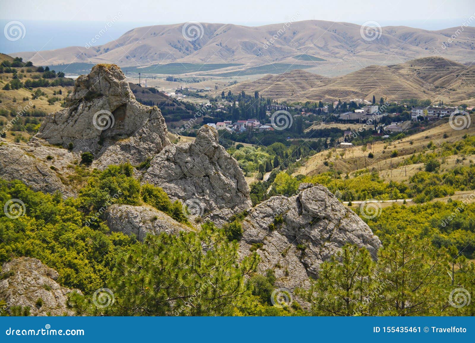 Three Rock with Mountains and the Sea in the Background Stock Image ...