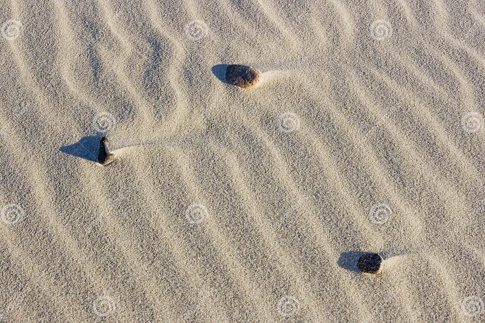 Three rocks in desert sand stock image. Image of effect - 4759479