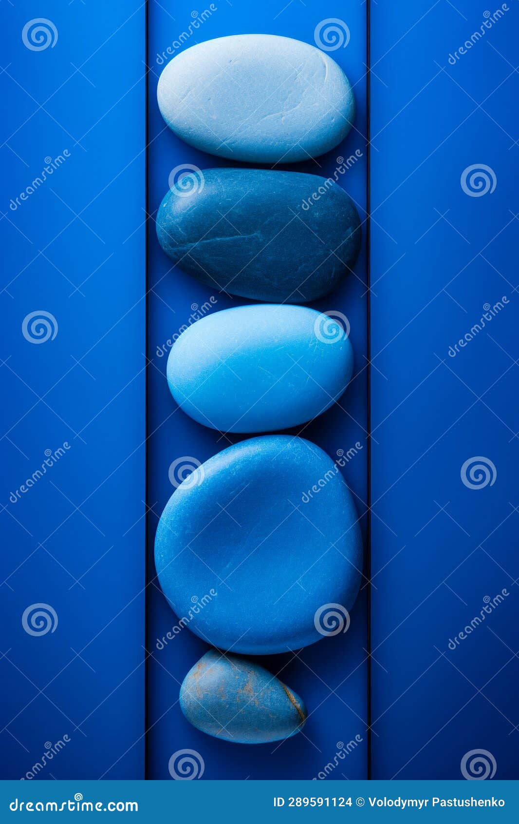 Three Rocks Sitting in Row on Blue Background with White Border ...