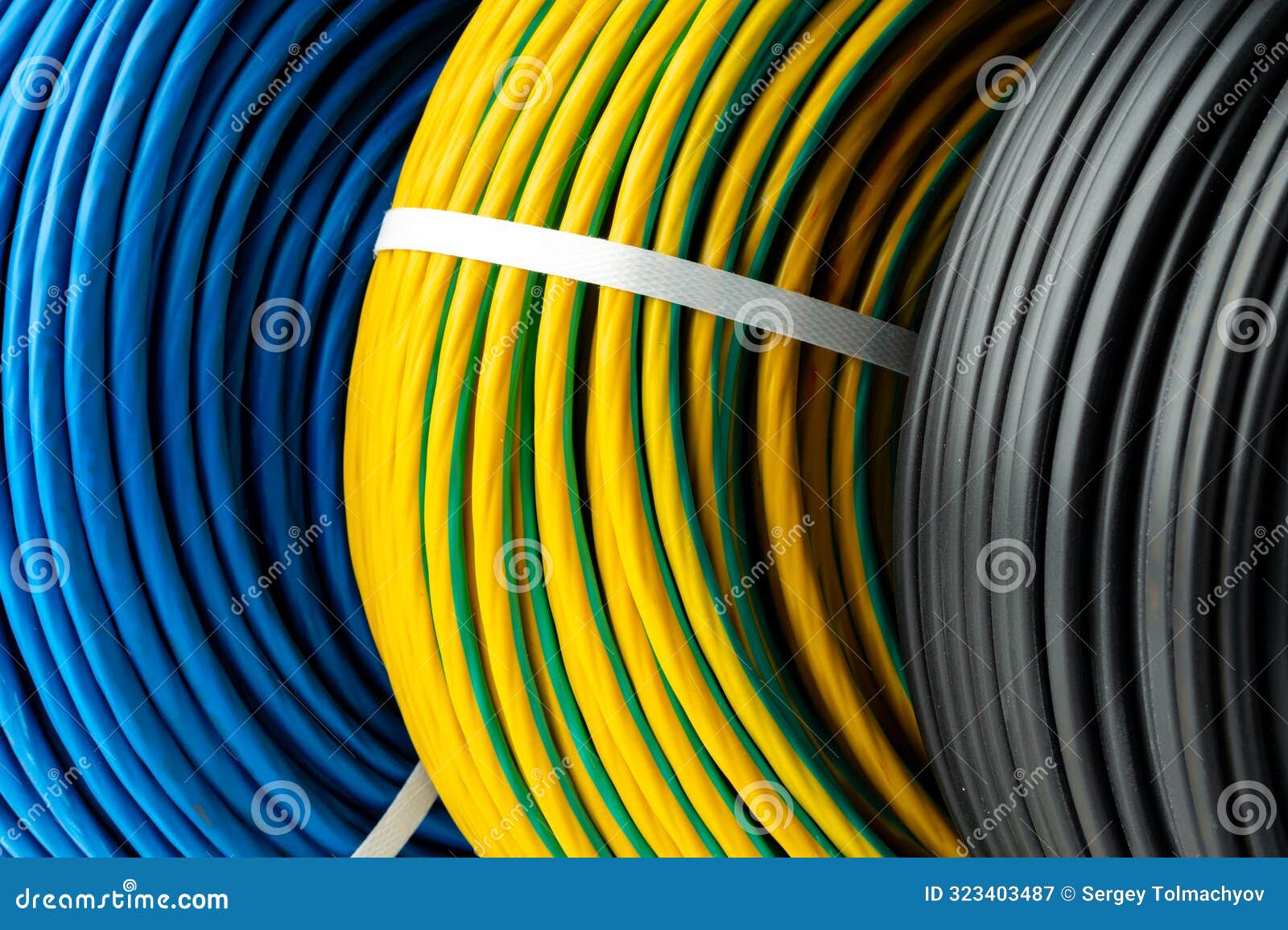 Three Rolls of Electrical Wire in Blue, Yellow and Green, and Black ...