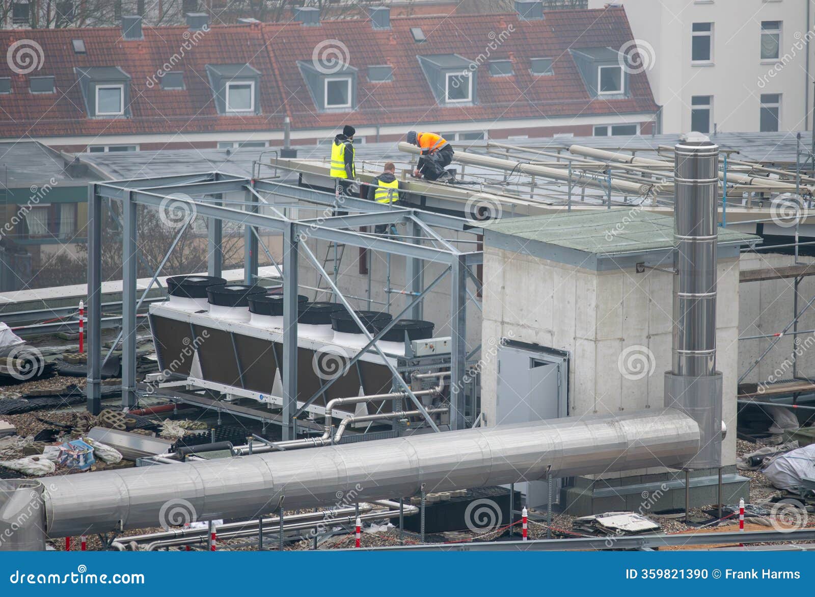 Three Roofer Install the Automatic Opening of a Roof Window a Business ...