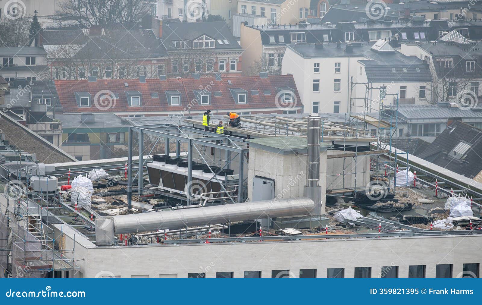 Three Roofer Install the Automatic Opening of a Roof Window a Business ...