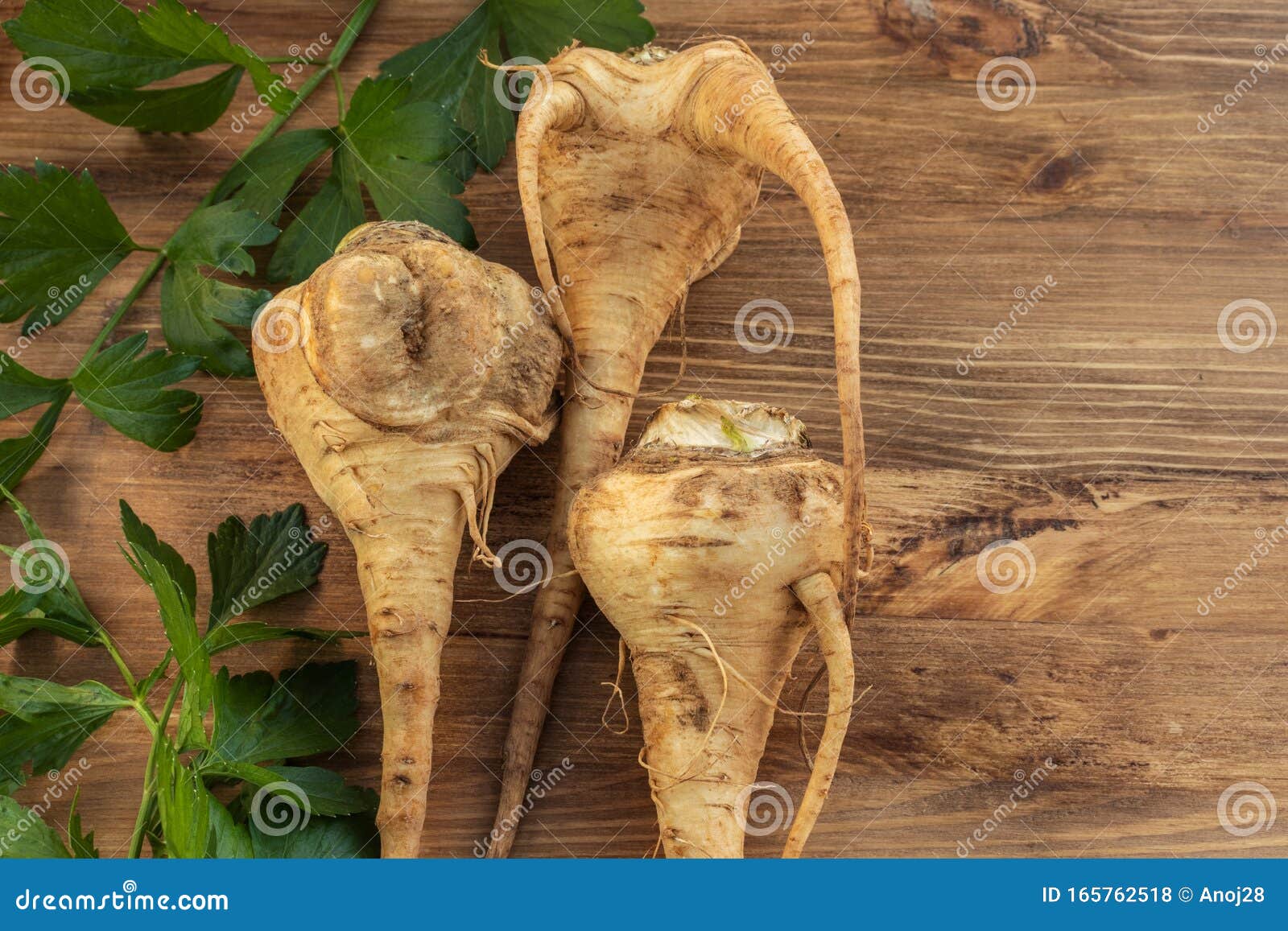 Three Root Crops of Parsnip on a Light Brown Wooden Surface Stock Photo ...