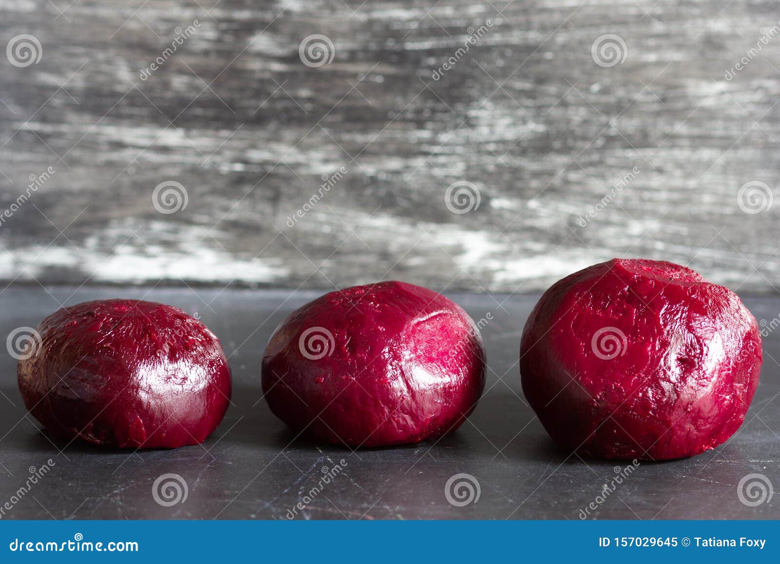 Three Roots of Cooked Peeled Beet in a Row on the Black Background ...