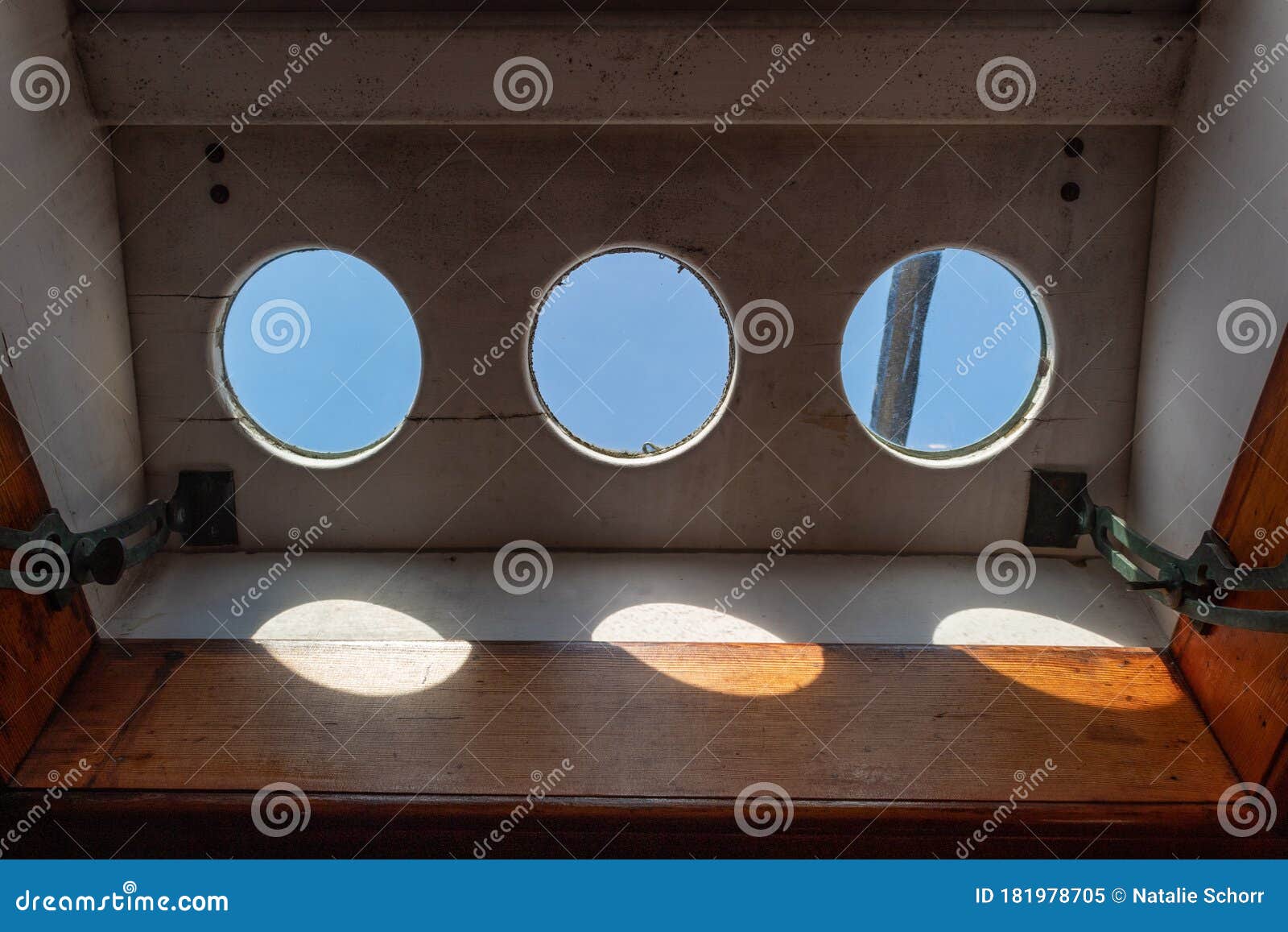Three Round Portholes Seen from Inside a Ship Looking Out on the Ship`s ...
