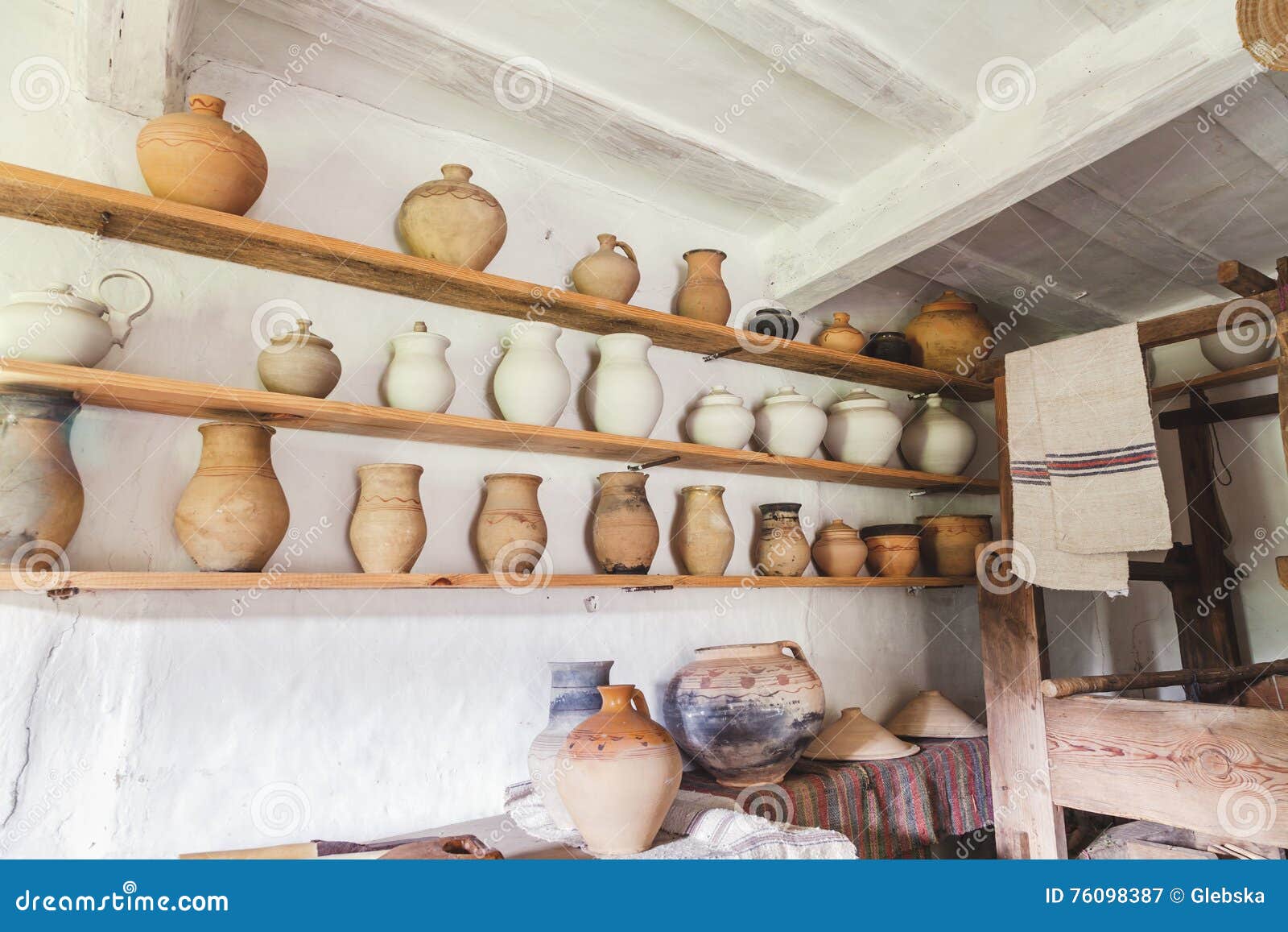 Three Rows of Different Pitchers on Wall Stock Image - Image of brown ...