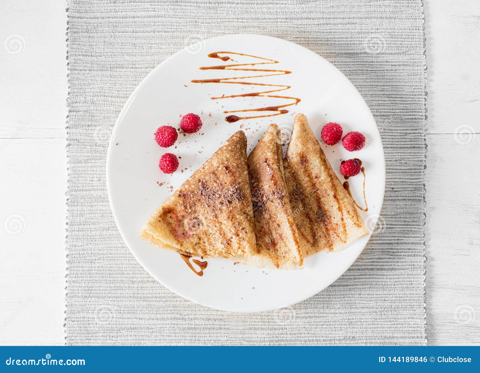 Three Russian Thin Pancakes and Crepes Folded Triangle with Raspberries ...