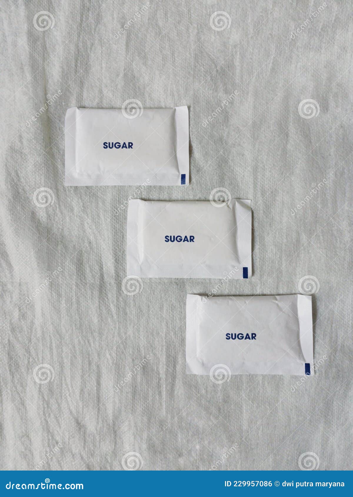 Three Sachet White Sugar on Table Stock Photo - Image of text, object ...