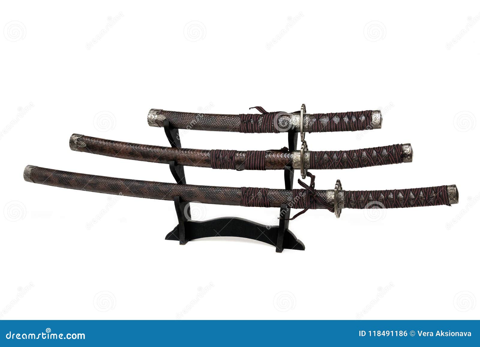 Three Samurai Swords Hang On Wall Next To Table Royalty-Free Stock ...