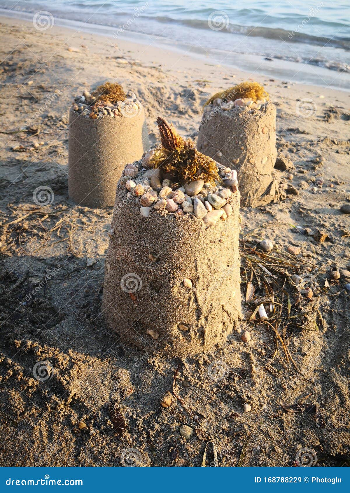 Three Sand Castle on the Beach Stock Image - Image of childhood, sand ...
