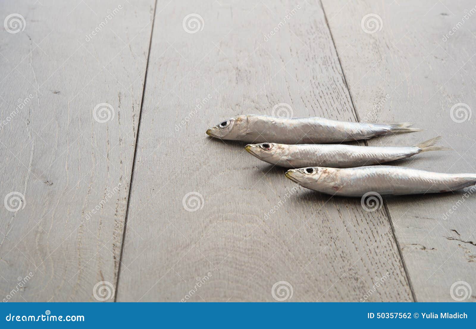 Three Sardines on Wooden Table Stock Photo - Image of fishing, health ...
