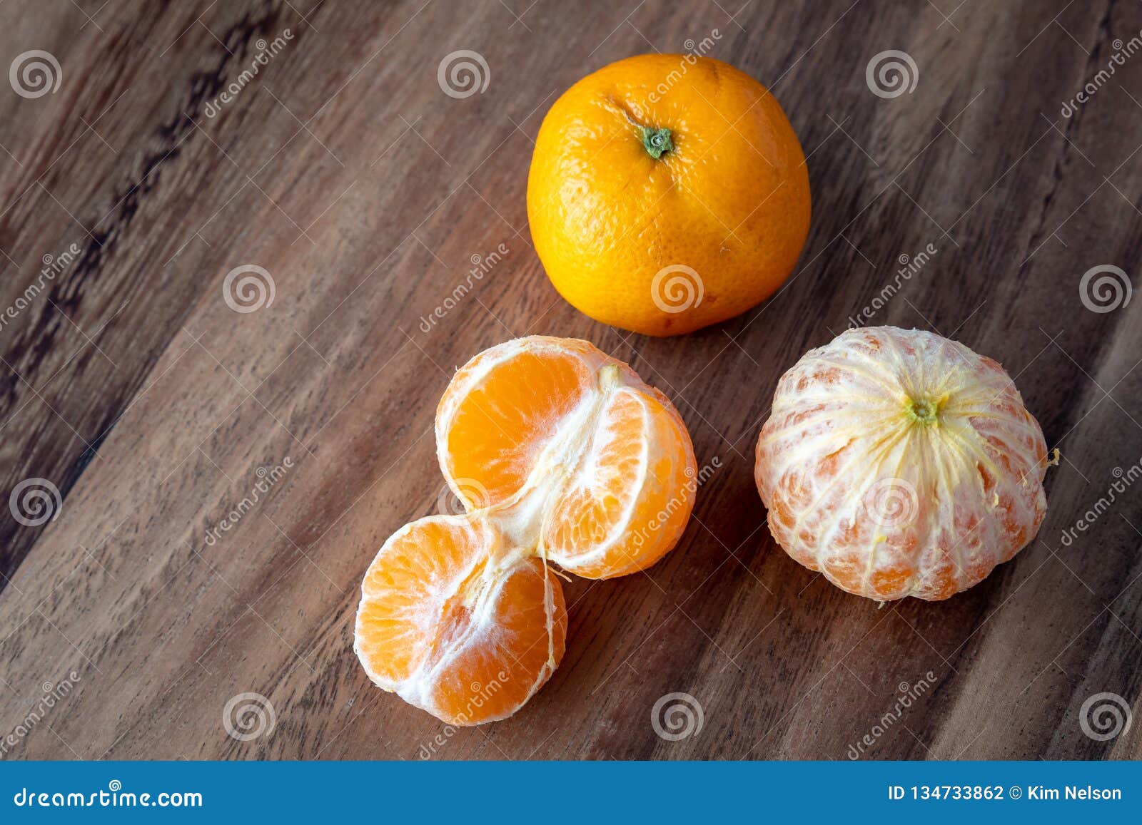 Three Satsuma Oranges on a Rustic Wood Table Stock Photo - Image of ...