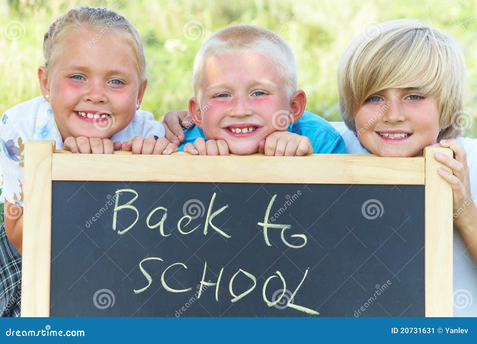 Three school children stock image. Image of back, chalkboard - 20731631