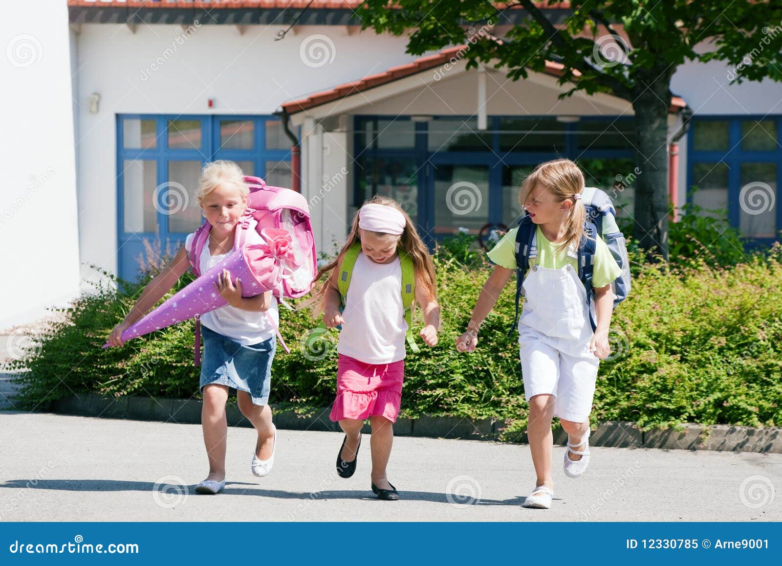 Three Schoolchildren Having Fun Stock Image - Image of backpack, child ...