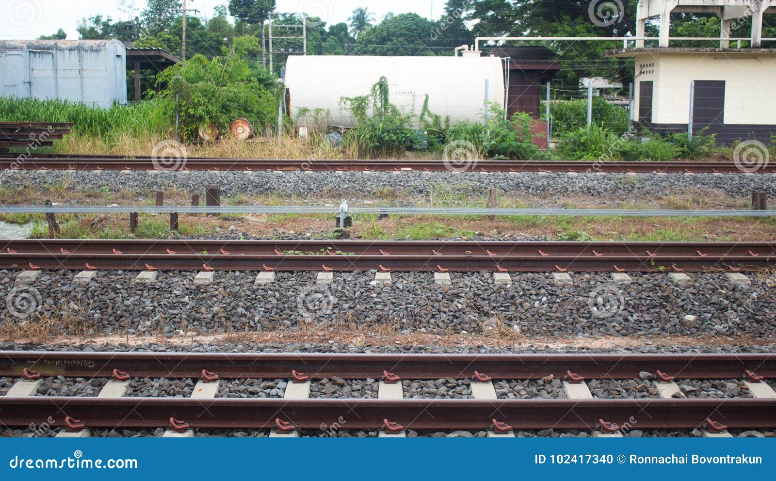 Three Sets of Railroad Tracks Run Straight Stock Photo - Image of metal ...