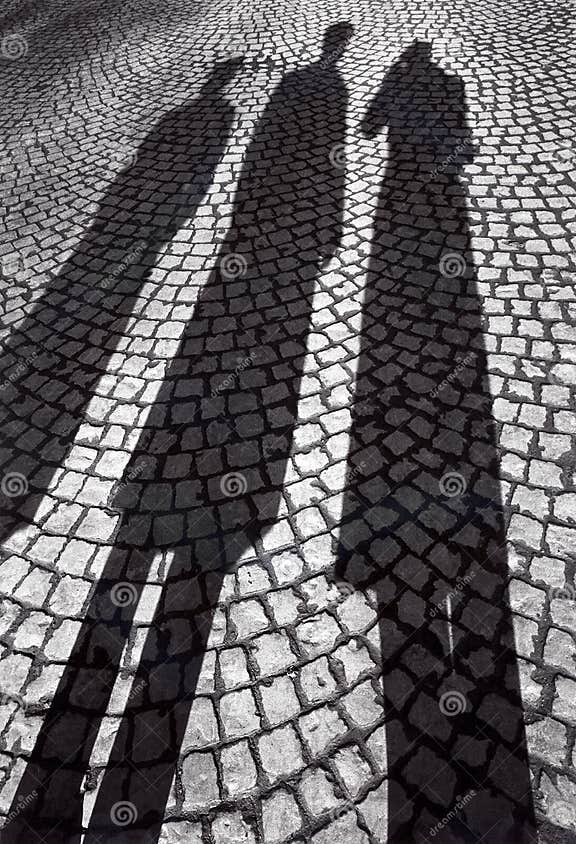 Three shadows stock image. Image of people, street, shadows - 12427625