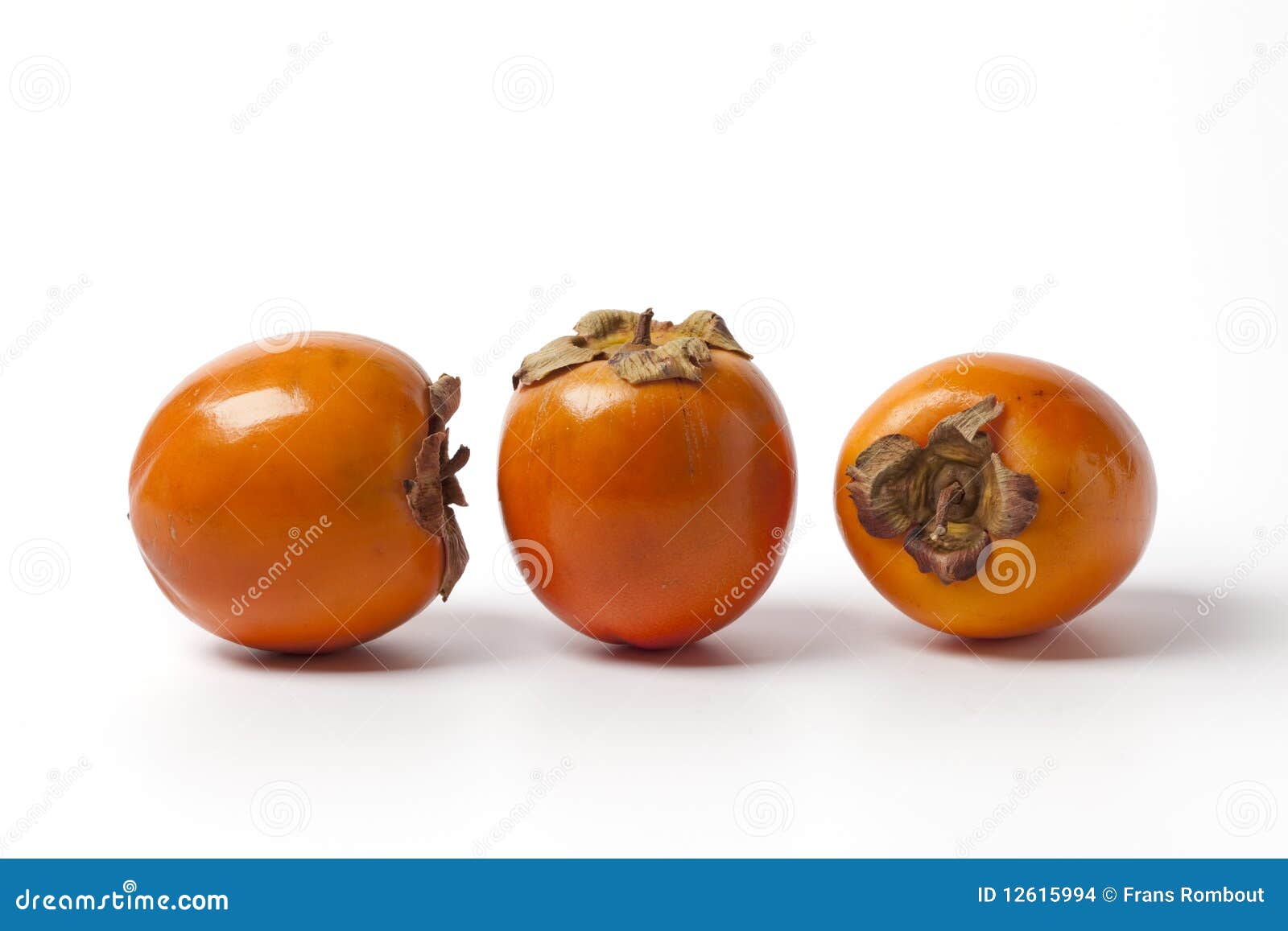 Three Sharonfruit in arow stock photo. Image of fresh - 12615994