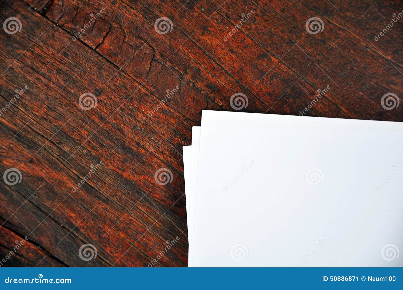 Three Sheets of White Paper Lying on a Wooden Surface Stock Image ...
