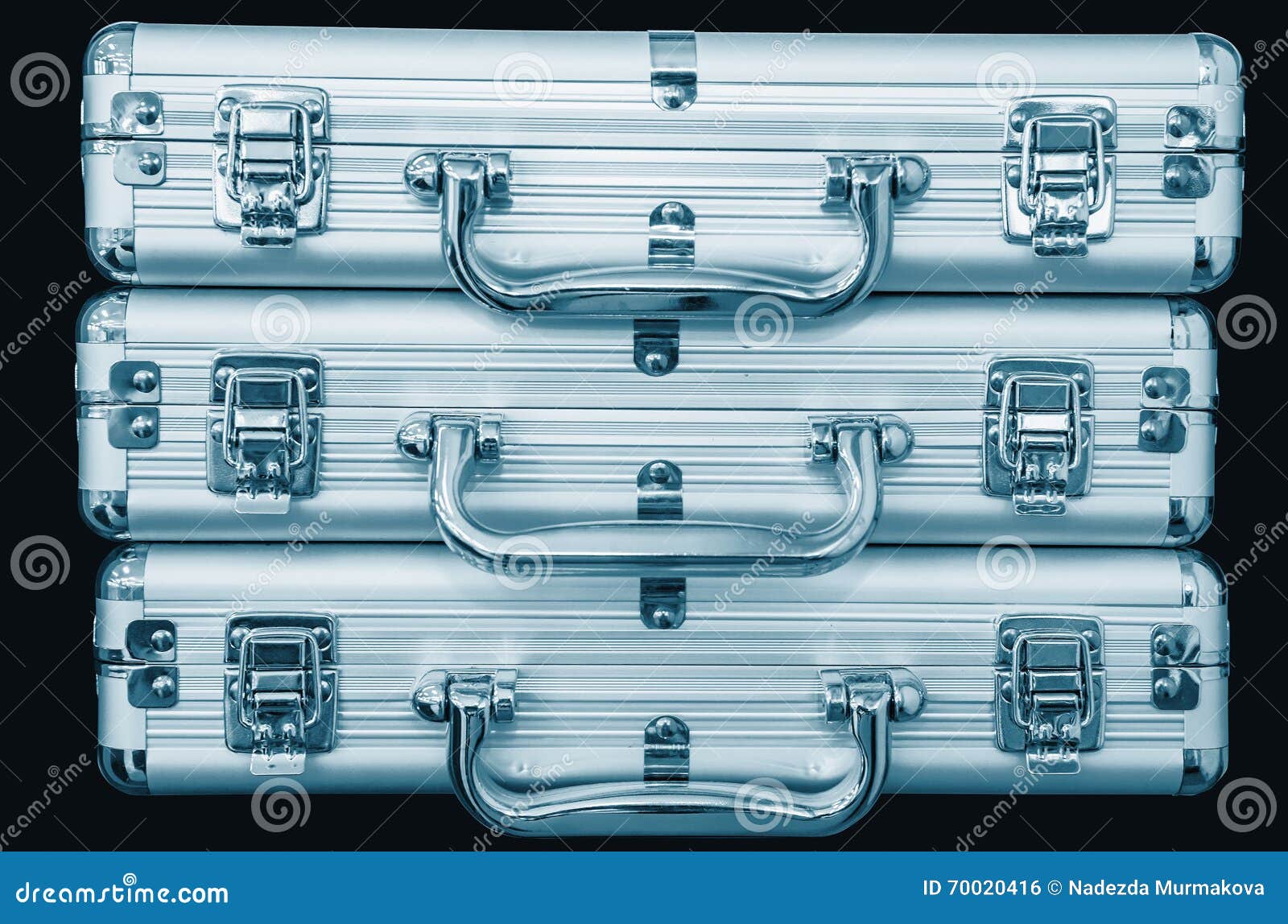 Three Silver Trunks on a Black Background Stock Photo - Image of ...