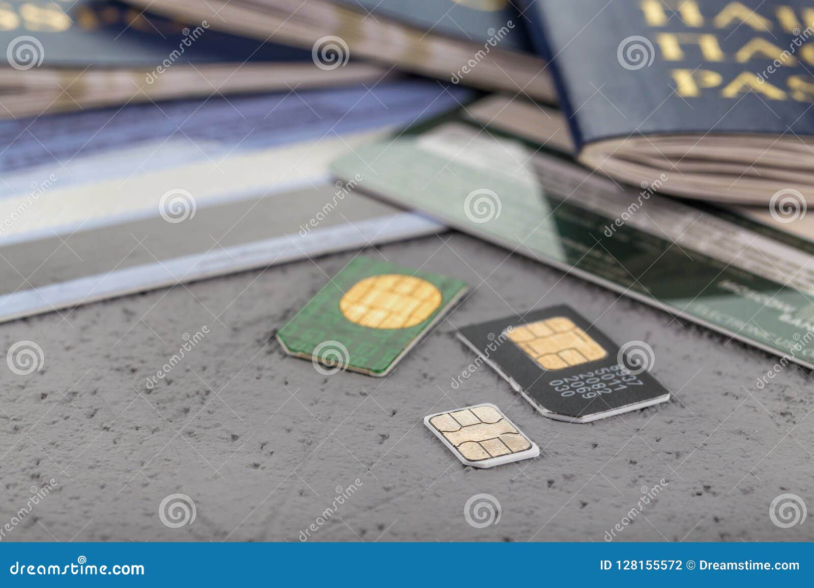 Three SIM Cards of Different Sizes Lie on a Rough Surface. Close-up ...