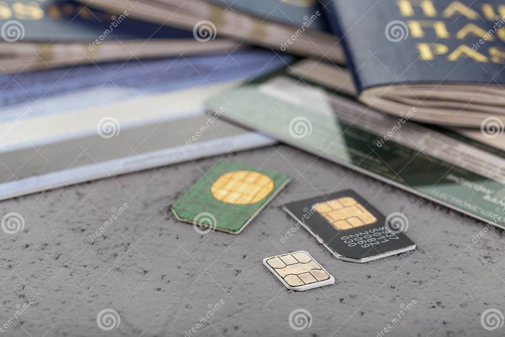 Three SIM Cards of Different Sizes Lie on a Rough Surface. Close-up ...