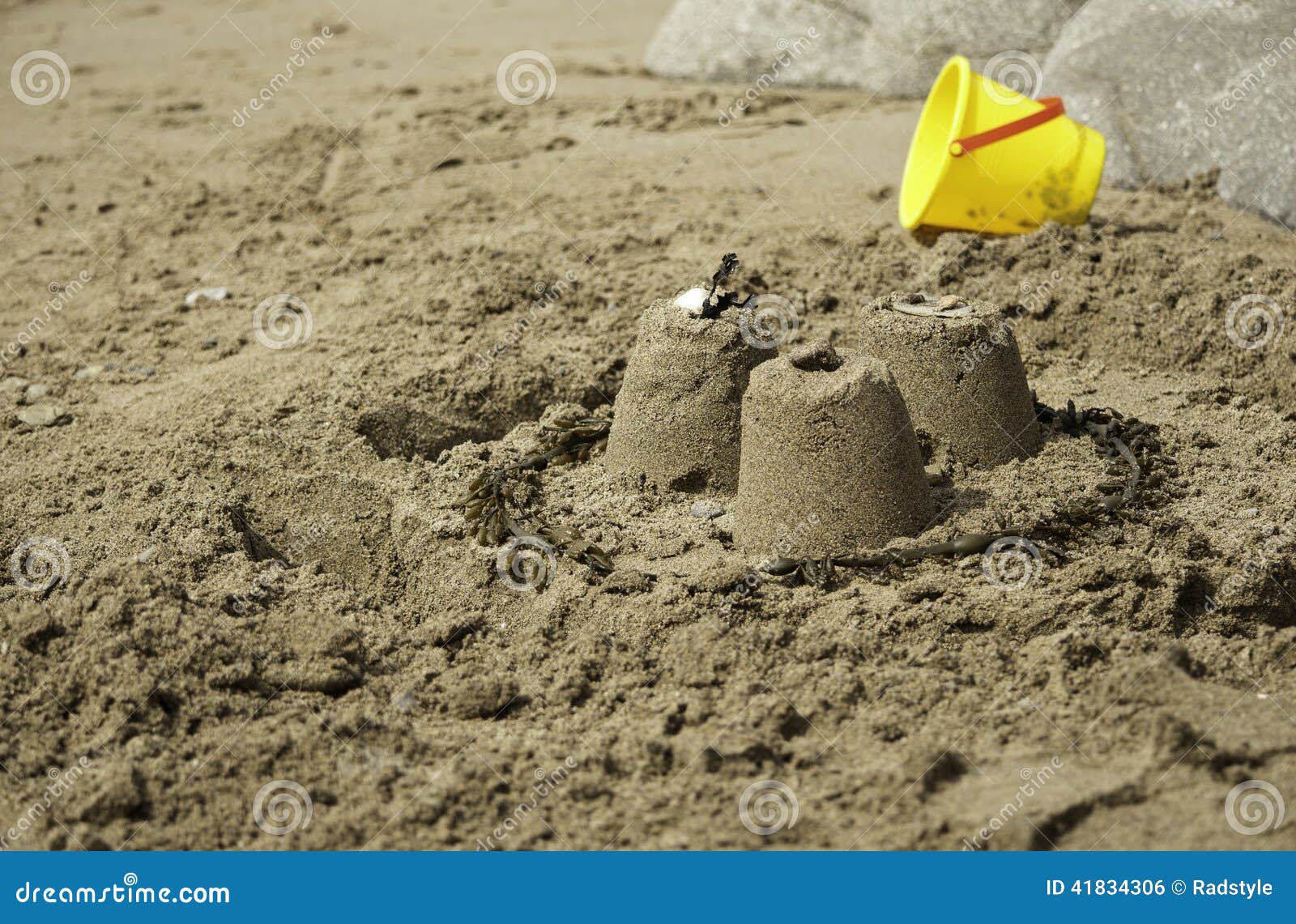 Three Simple Sandcastles With Yellow Bucket Stock Photography ...