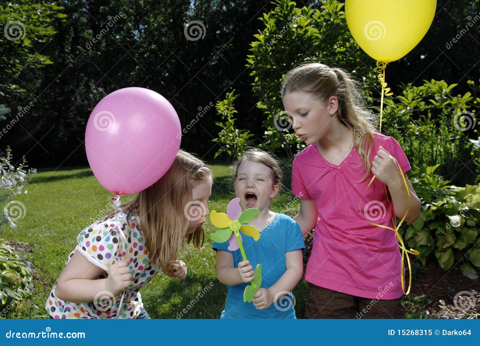 Three Sisters Play with the Windmill Stock Image - Image of faces ...