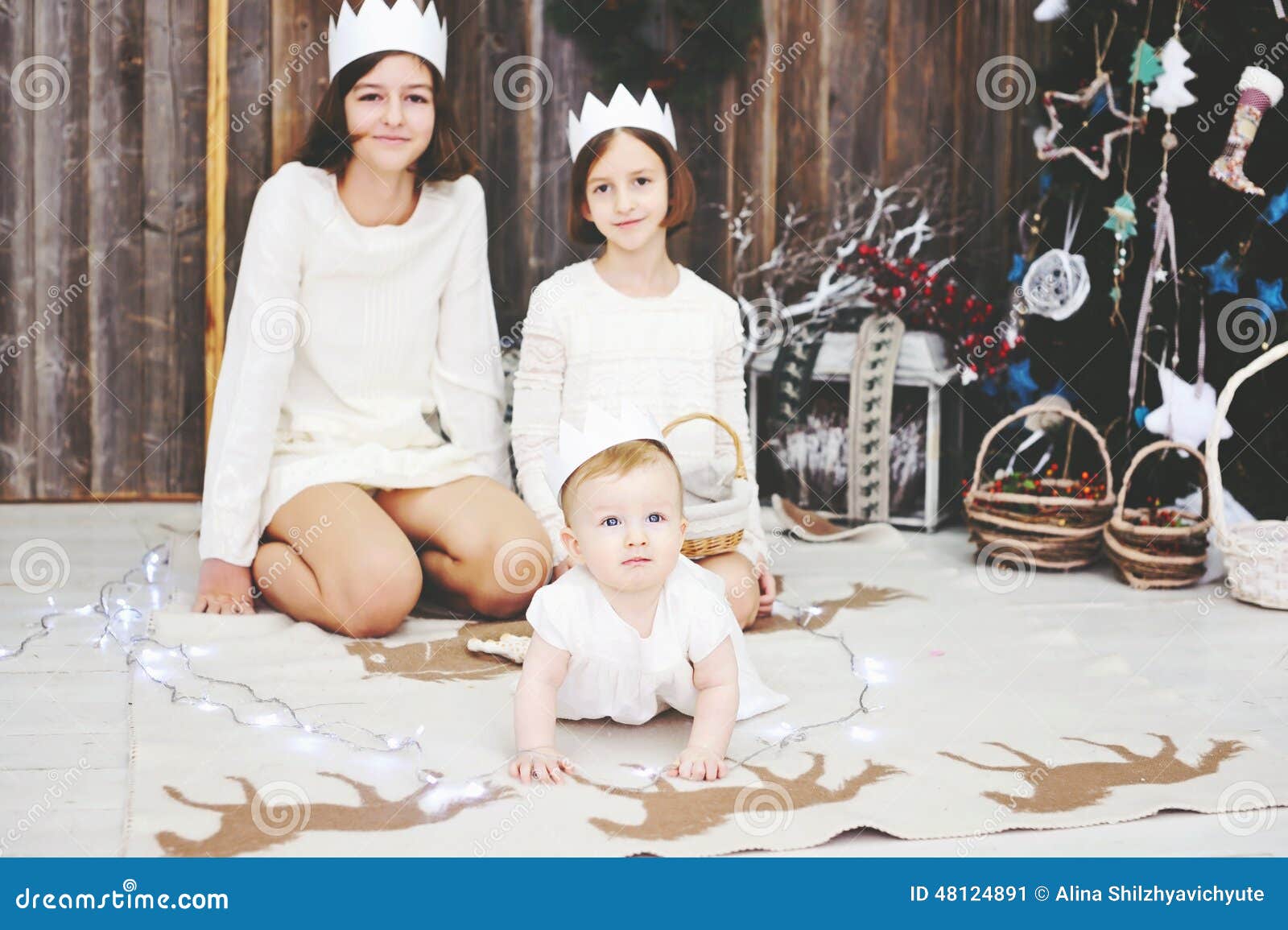 Three Sisters Posing in Front of Christmas Tree Stock Image - Image of ...