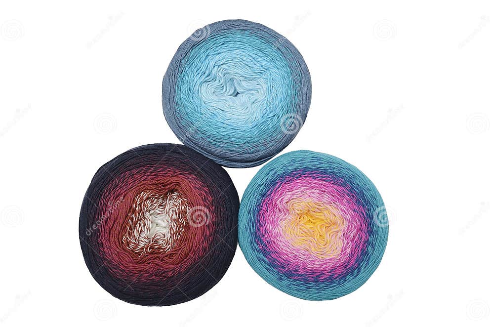 Three Skeins of Multicolored Yarn in Gradient Patterns Arranged on a ...