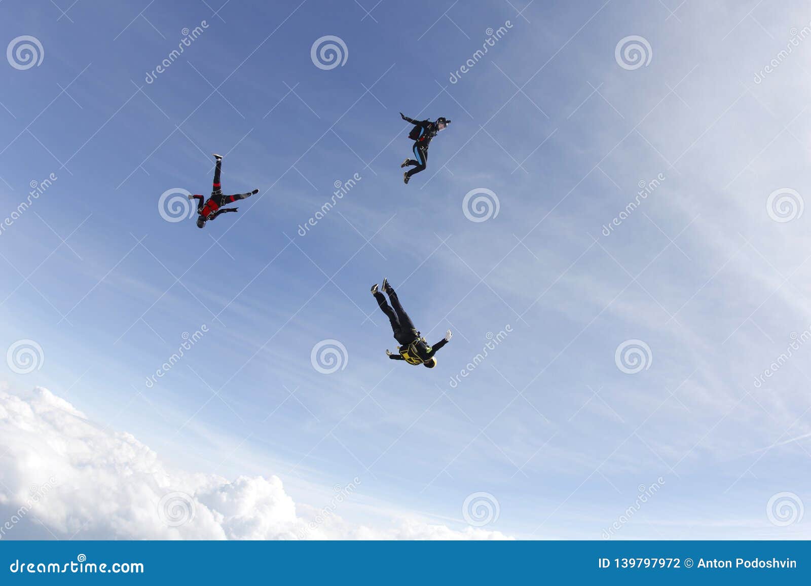 Three Skydivers are in the Blue Sky. Stock Photo - Image of moving ...